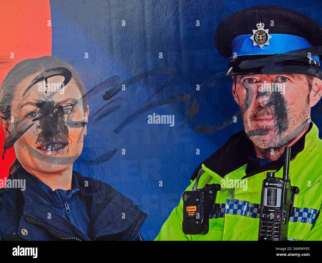 A defaced police poster in Brighton Stock Photo - Alamy
