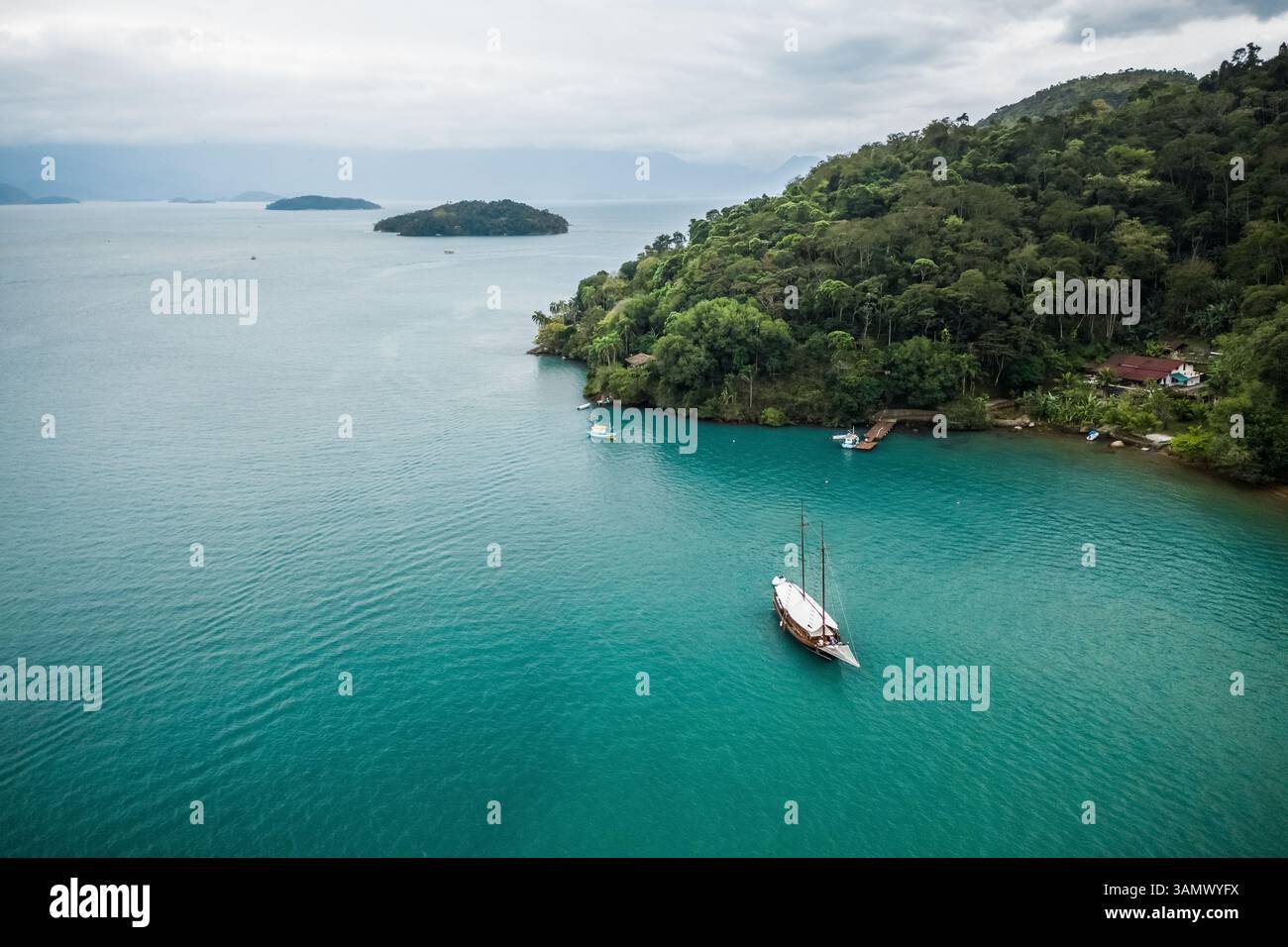 Aerial View Of Sail Boat Anchored In The Turquoise Waters Off The Coast ...