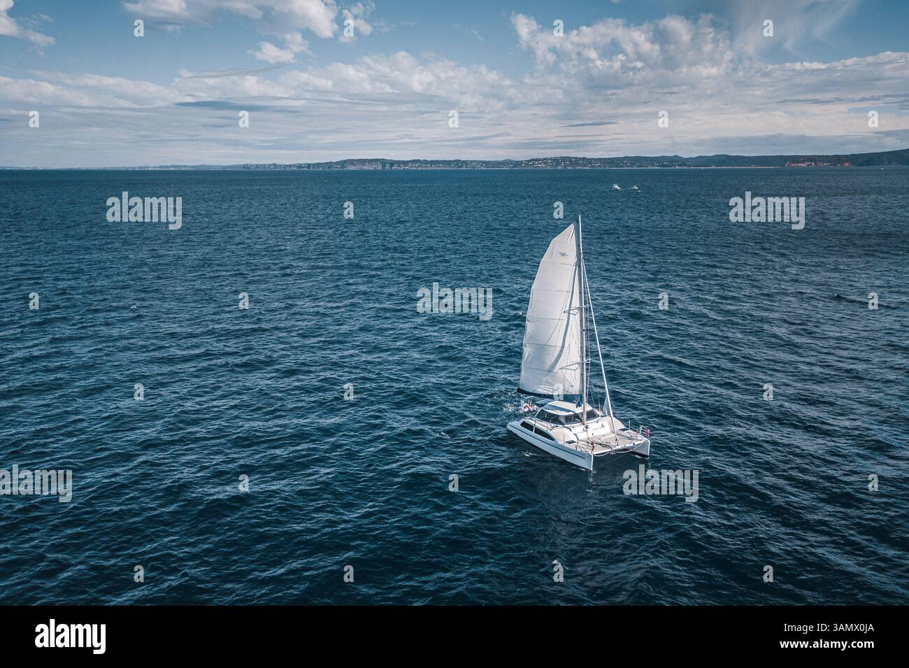 Aerial View Of Catamaran Sail Boat Sailing In The Pacific Ocean Along ...
