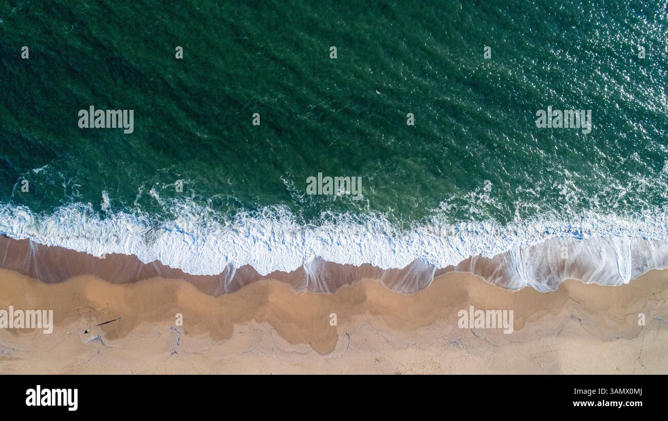 Aerial view of transparent turquoise water and sandy beach, Mansa Beach ...
