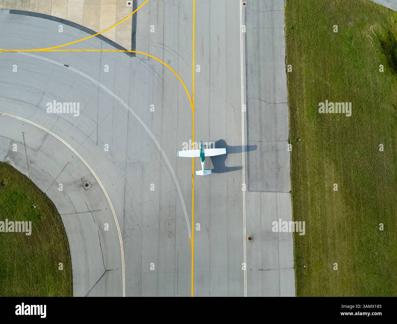 Aerial view of the beautiful runway and airport with an airplane ...