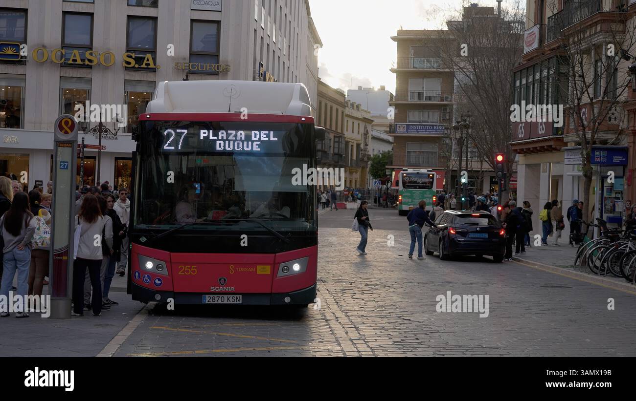 Passengers waiting for the bus number 27 to Plaza del Duque in Seville ...