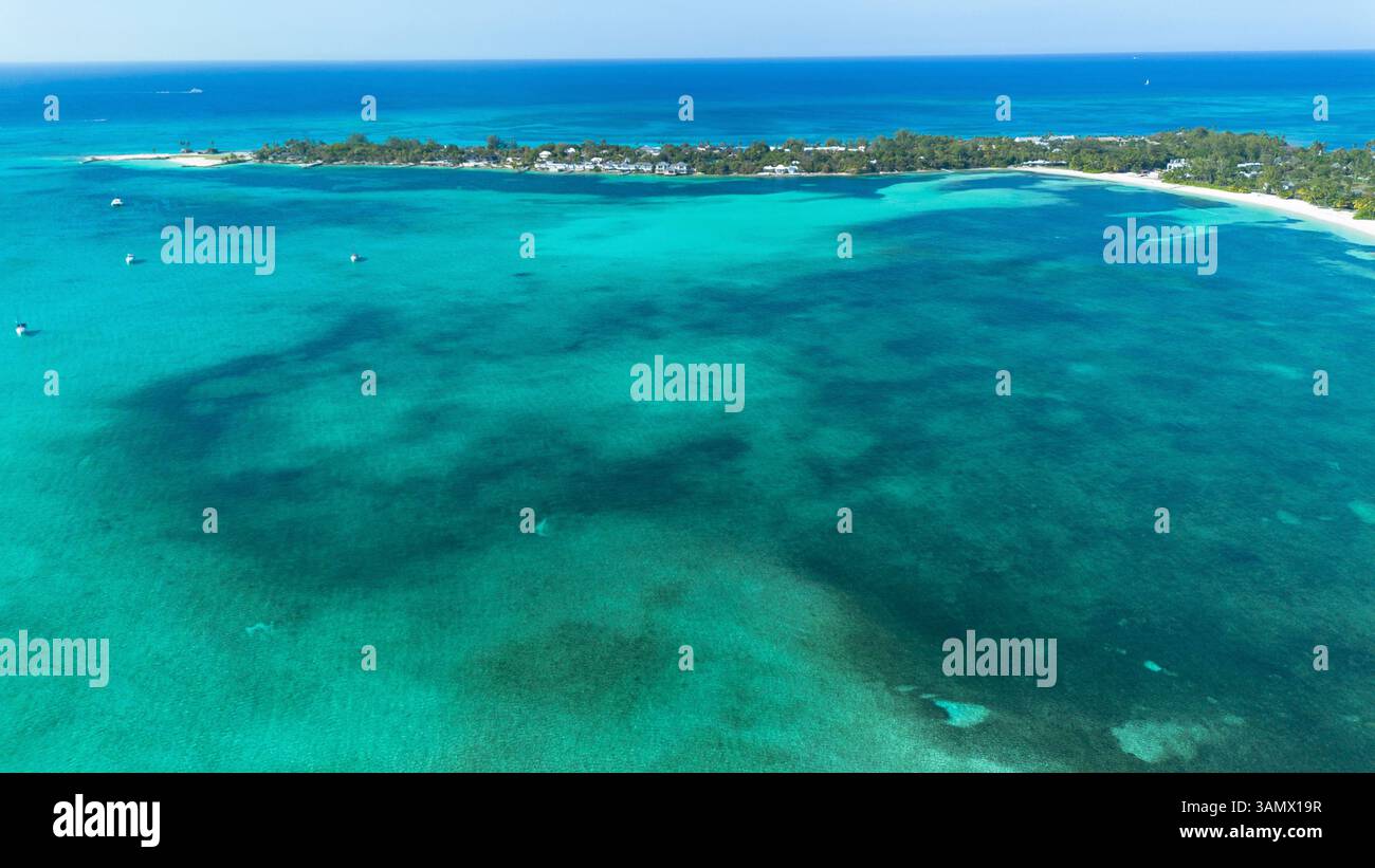 Aerial view of turquoise waters and sandy shore at Jaws Beach ...