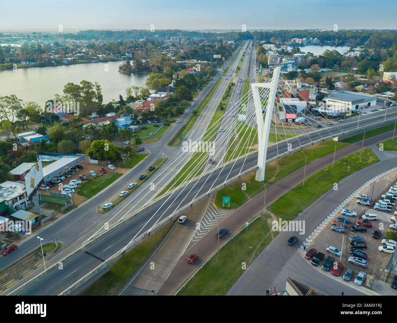 Aerial view of av de las americas bridge over a lake with cars and ...