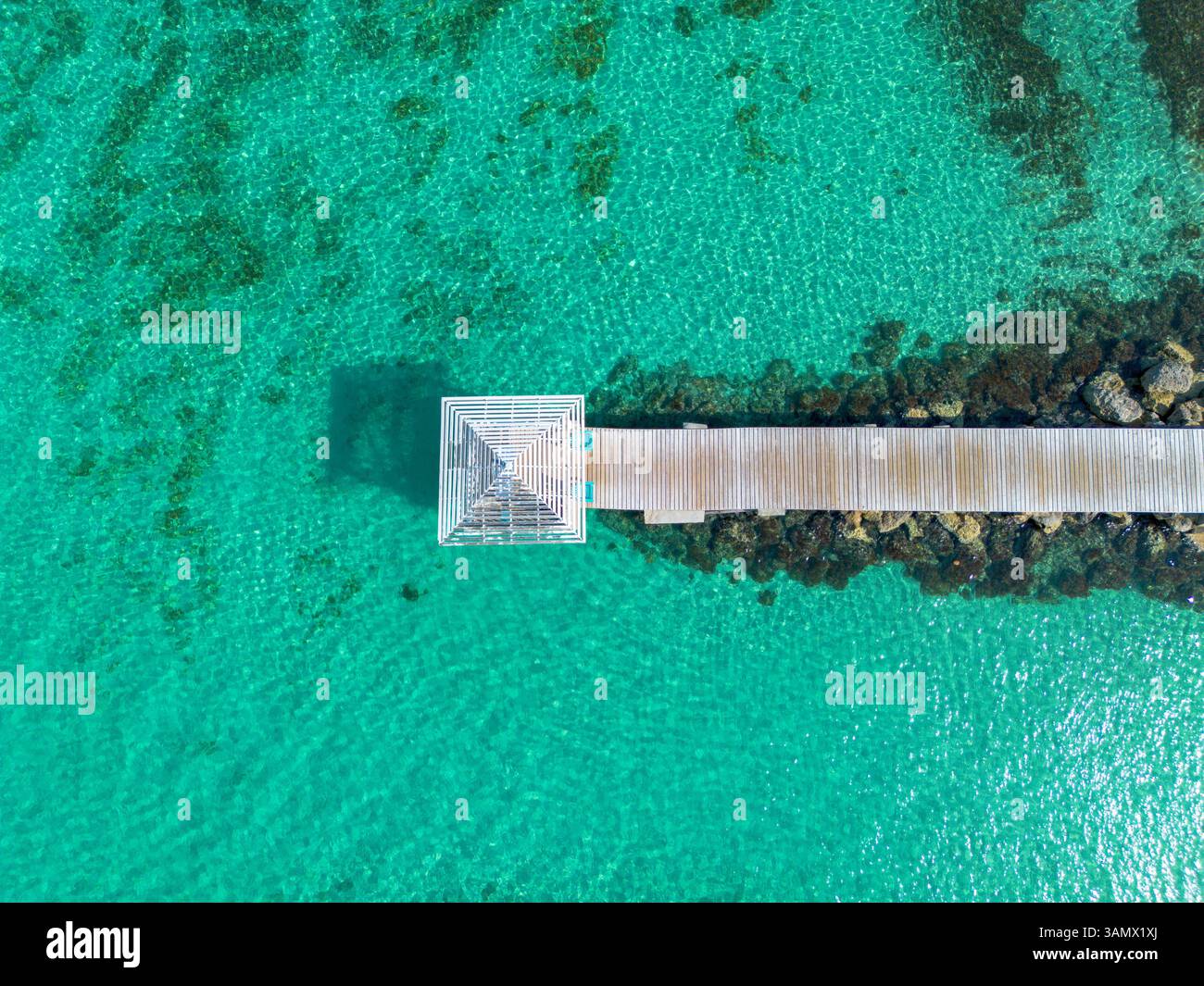 Aerial view of transparent water and sandyport beach, Delaporte Point ...