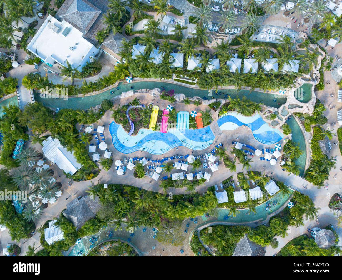 Aerial view of luxury resort with swimming pool and water reflection ...