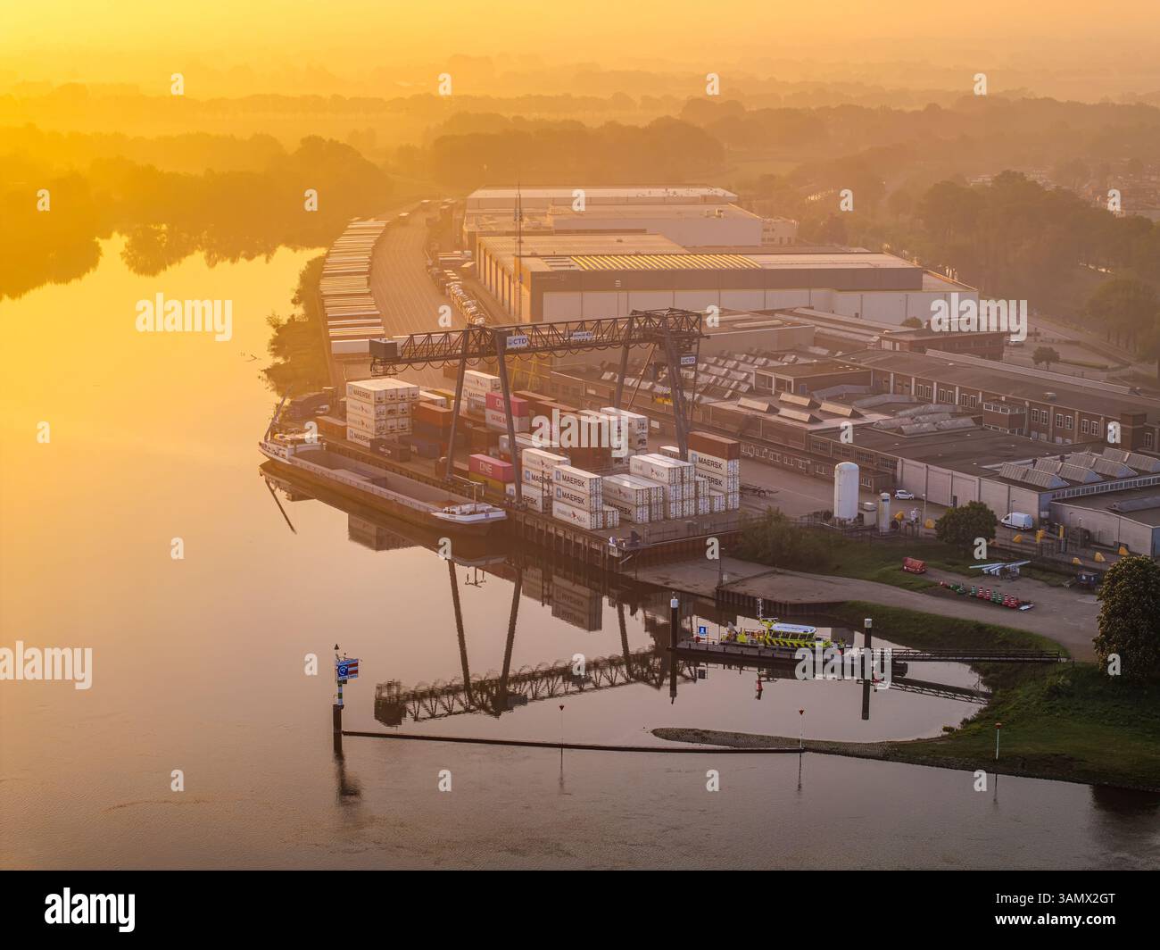 Aerial view of serene container terminal by the river with shipping ...