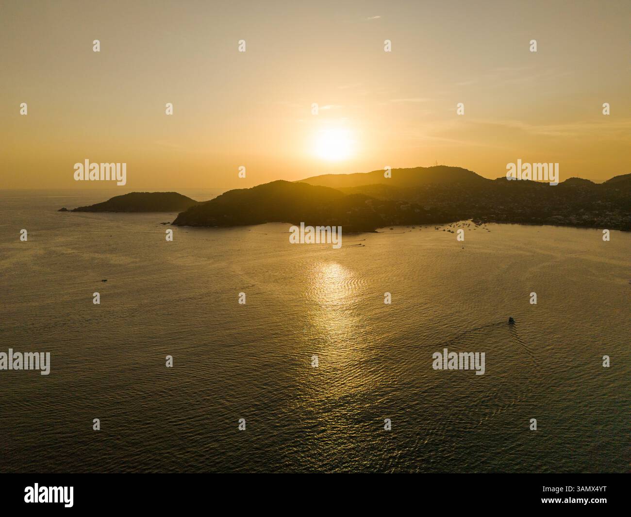 Aerial view of Ixtapa beach at sunset with tranquil ocean and ...