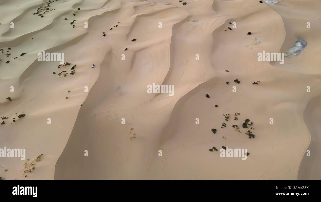 Aerial view of beautiful samalayuca dunes with wavy patterns in a vast ...