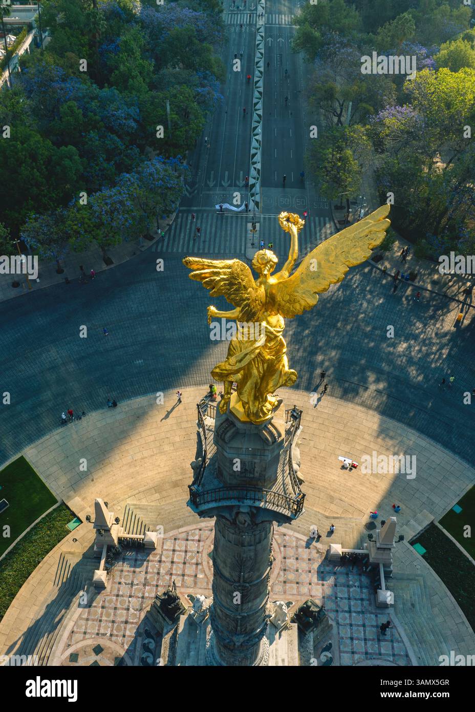 Aerial view of angel independencia monument surrounded by greenery and ...