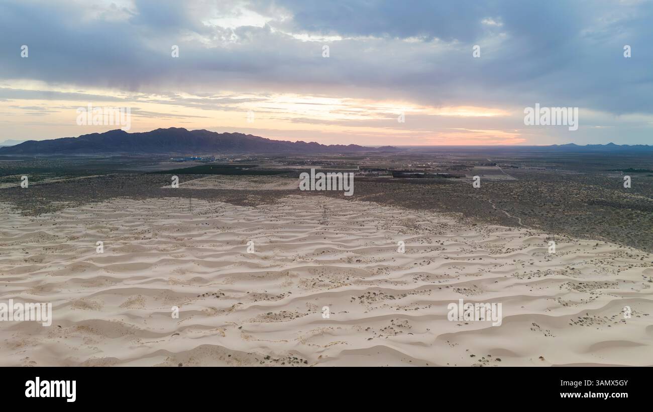 Aerial view of serene Samalayuca dunes at sunset with expansive sand ...