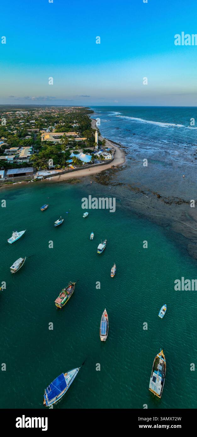 Aerial view of beautiful Praia do Forte beach with azure waters and ...