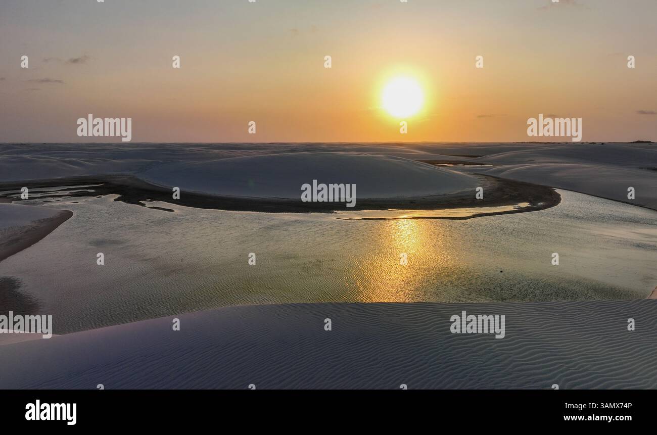 Aerial view of beautiful sand dunes and tranquil lagoons at sunset ...