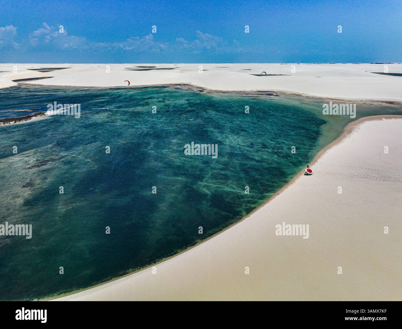 Aerial view of breathtaking sand dunes and serene turquoise lagoon ...
