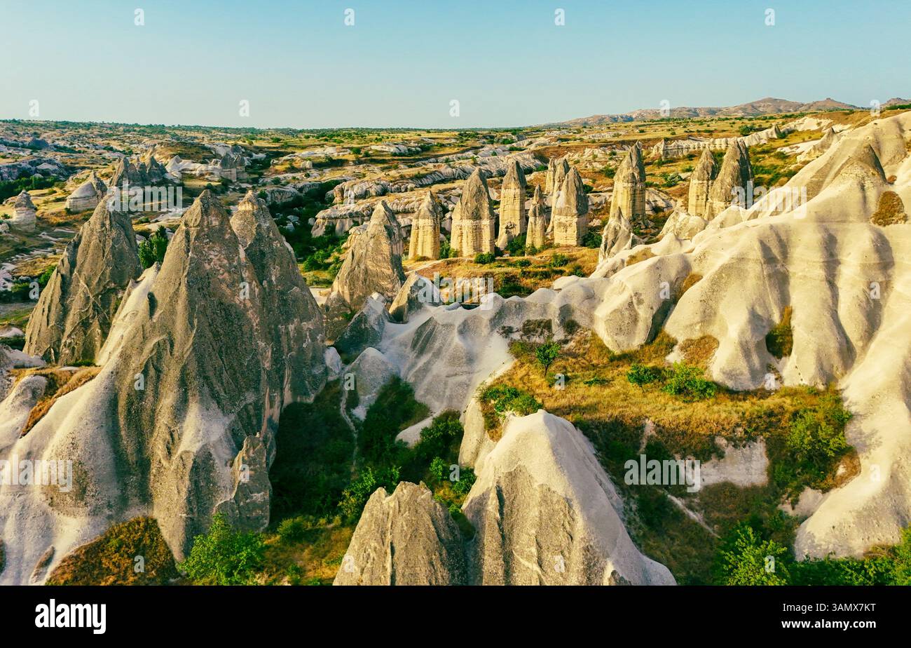 Aerial view of fairy chimneys and geological formations in a scenic ...