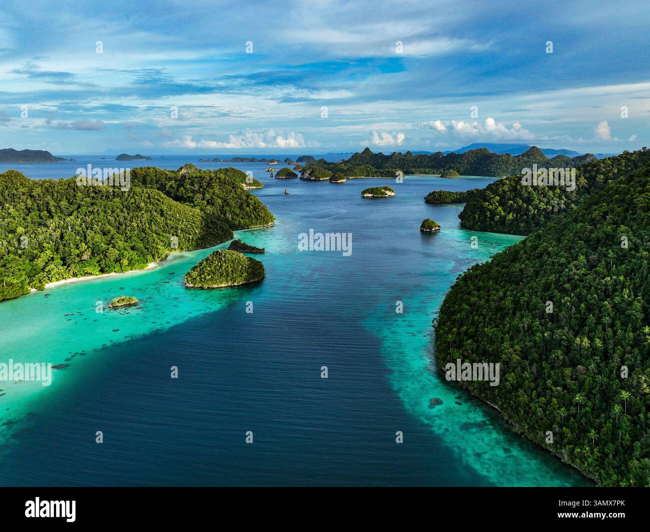 Aerial view of scattered islands with blue ocean water at Wajag Island ...