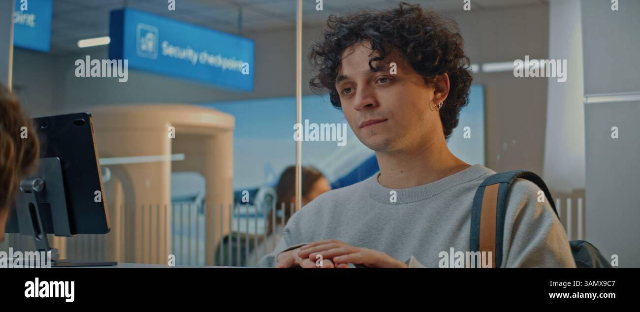 Airport Check-in Counter: Close Up of Young Man, Tourist Giving ...