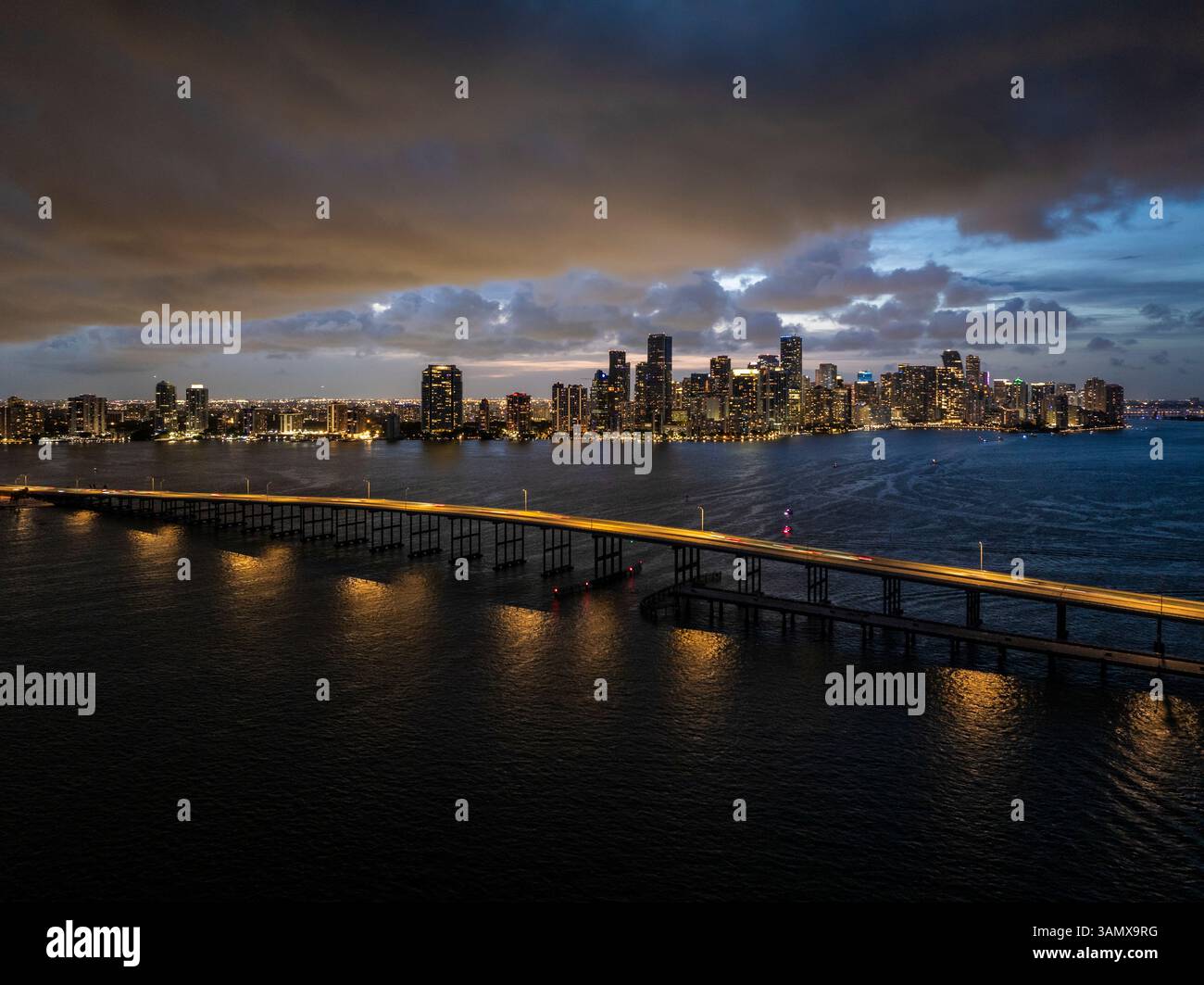 Aerial view of illuminated downtown Miami skyline with Rickenbacker ...