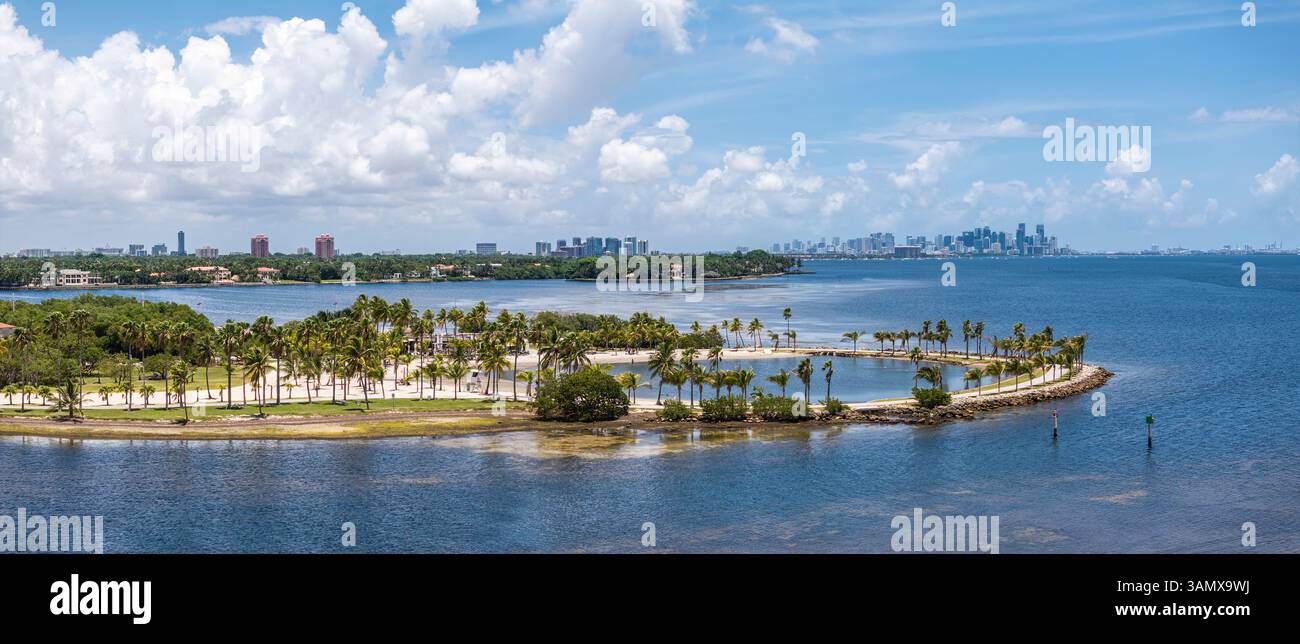 Aerial view of Matheson Hammocks Park with palm trees and urban skyline ...