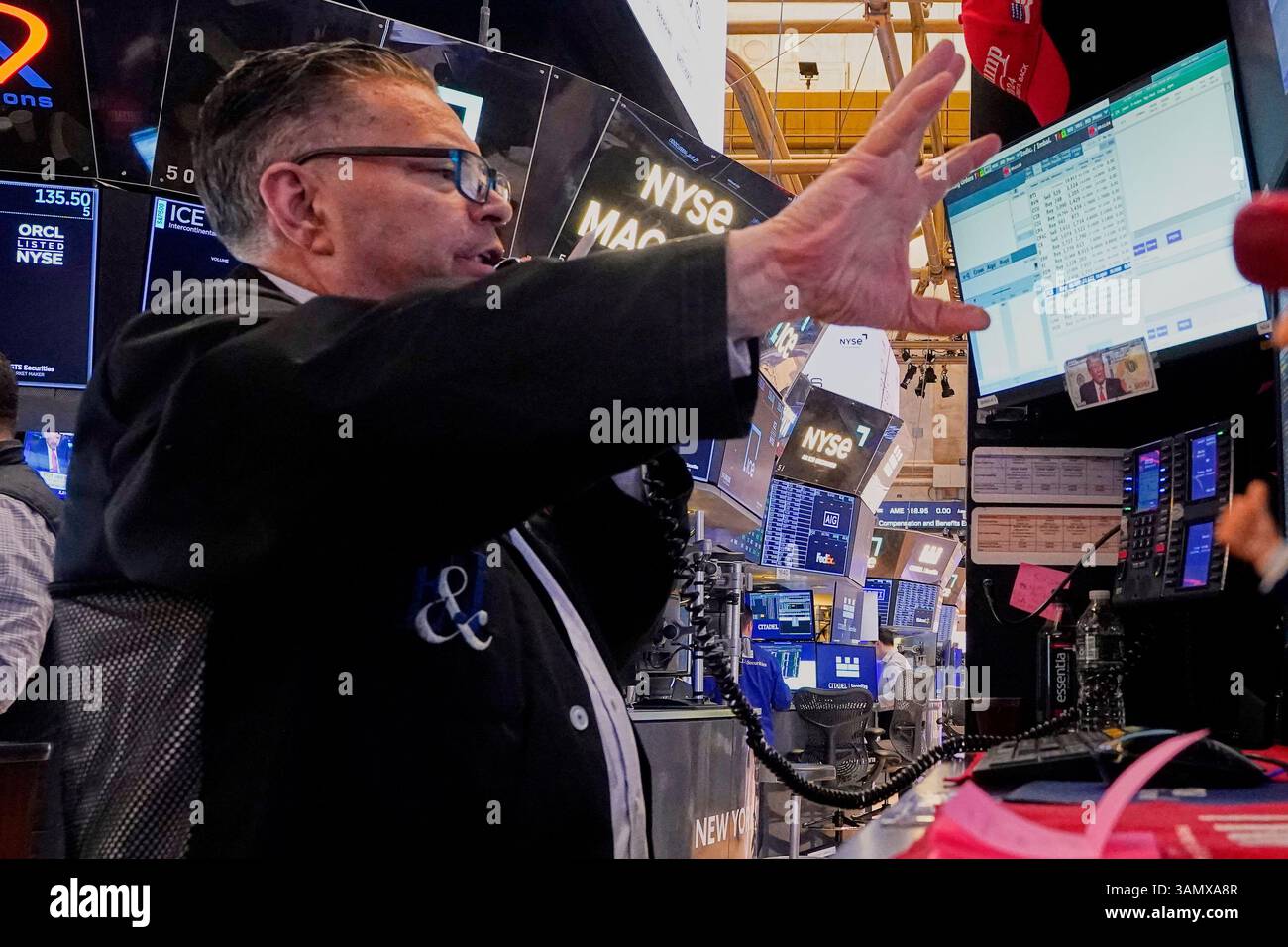 Trader Jonathan Mueller works on the floor of the New York Stock ...
