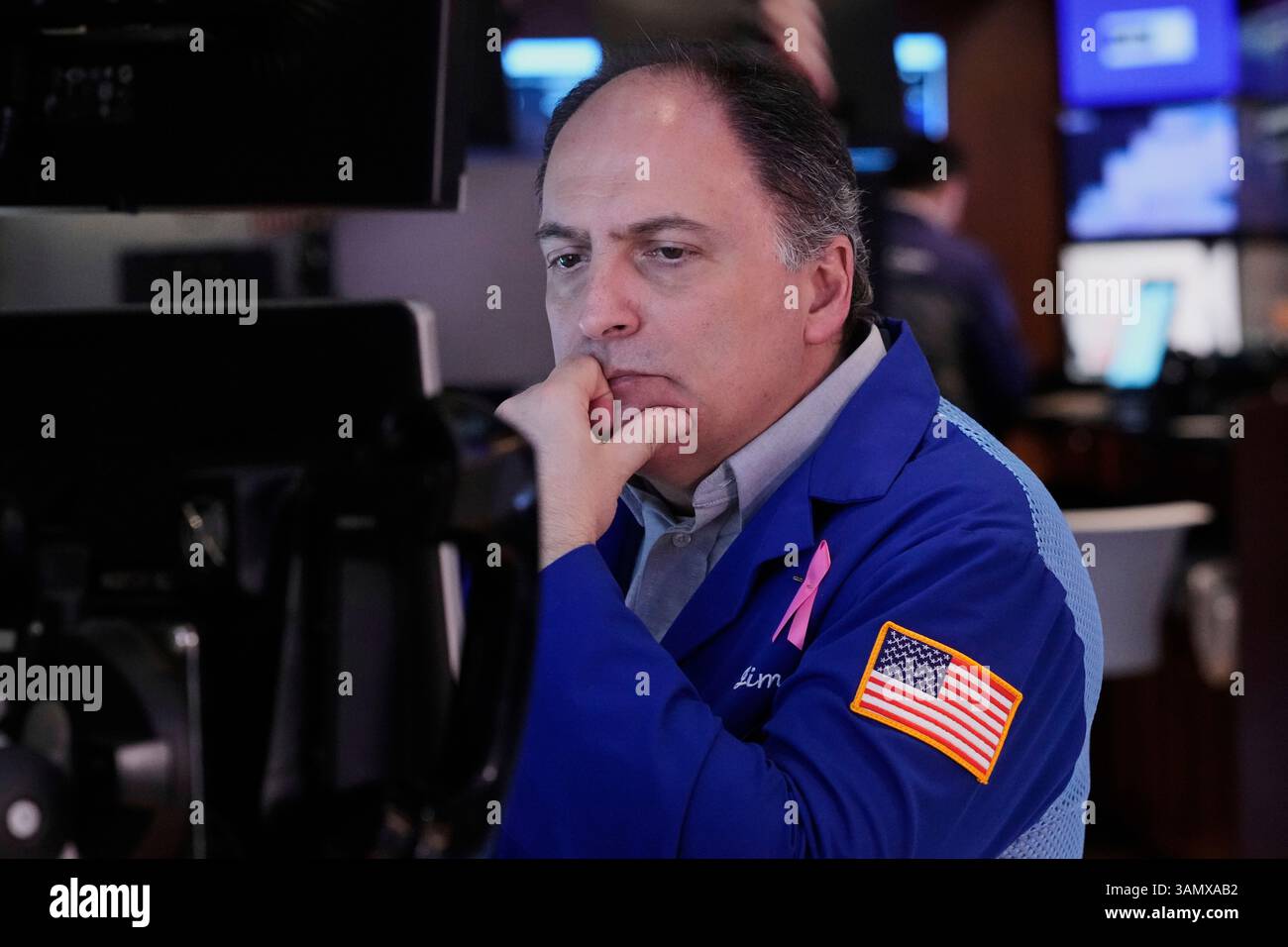 Trader James Conti works on the floor of the New York Stock Exchange ...