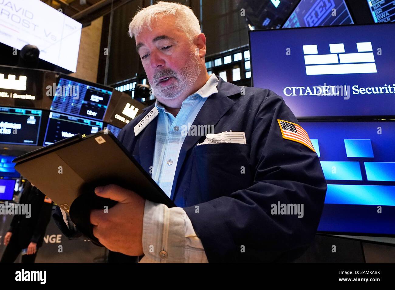 Trader Edward McCarthy works on the floor of the New York Stock ...