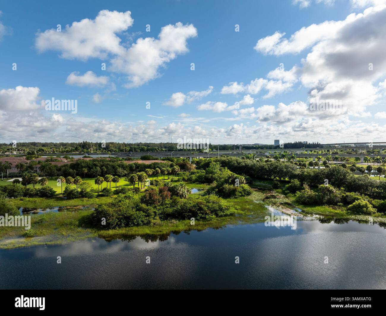 Aerial view of serene lake and lush greenery at Sawgrass Sanctuary Park ...