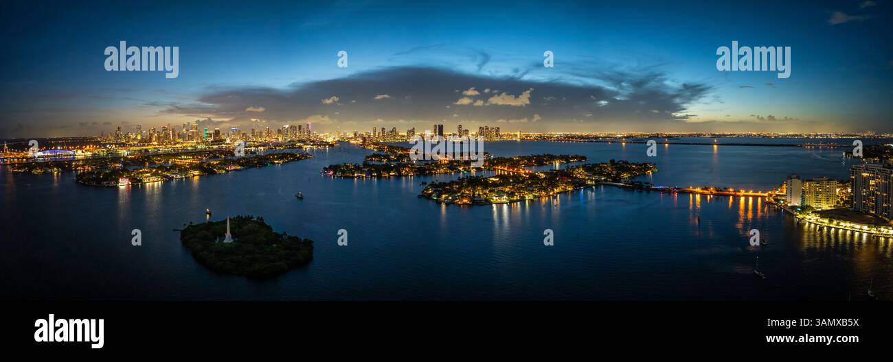 Aerial view of beautiful skyline and water with lights reflection at ...