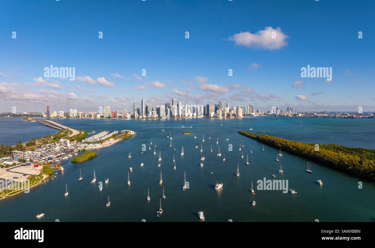 Aerial view of beautiful beach with boats and skyscrapers, Virginia Key ...