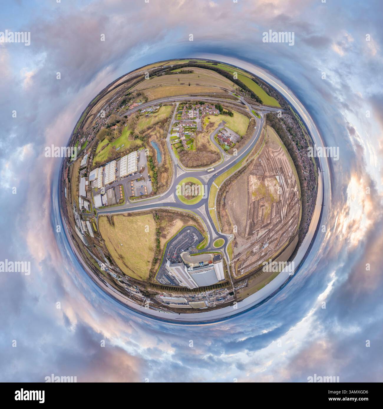 Aerial view of a tiny planet landscape featuring a roundabout ...