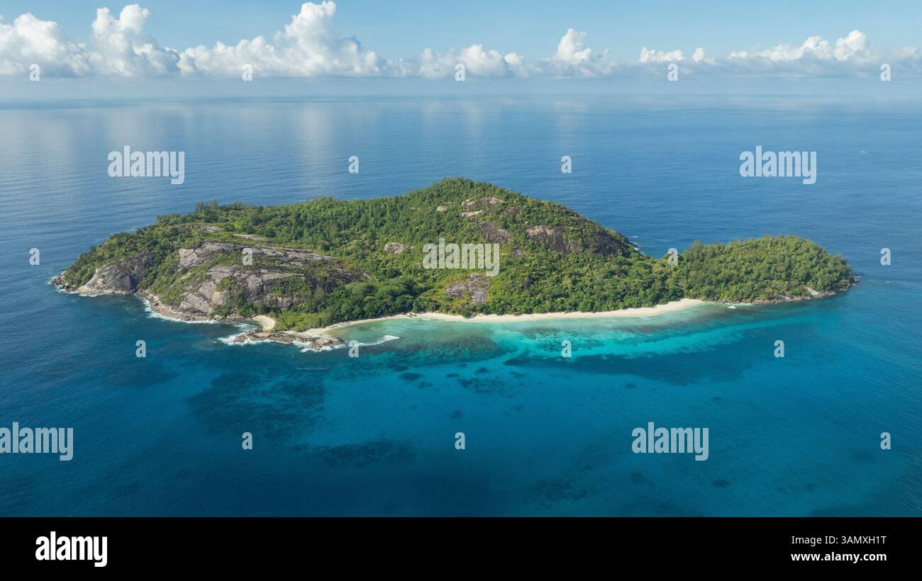 Aerial view of Therese Island with turquoise ocean and sandy beach ...