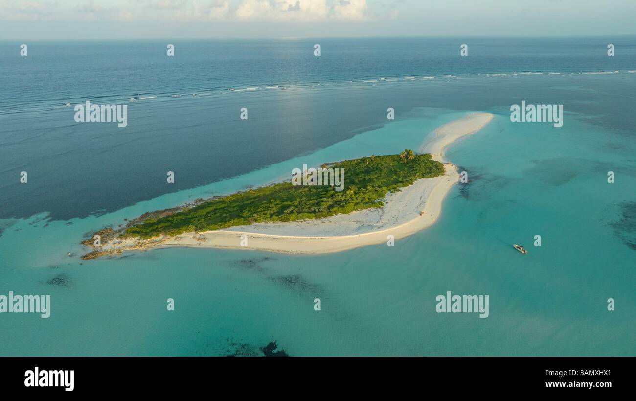 Aerial view of secluded island, sandbank, and lagoon with clear ...