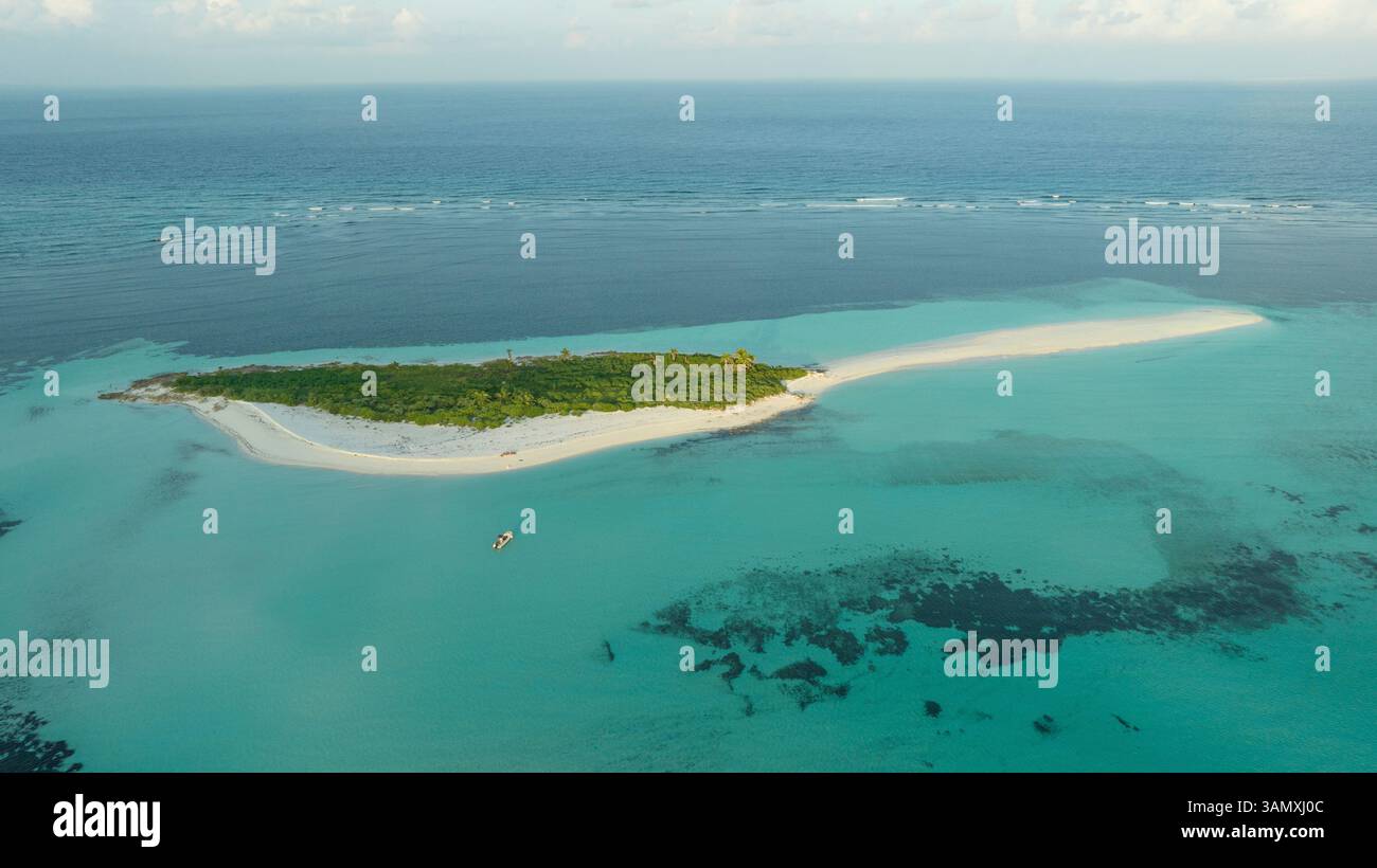 Aerial view of tranquil island, sandbank, and lagoon with clear water ...