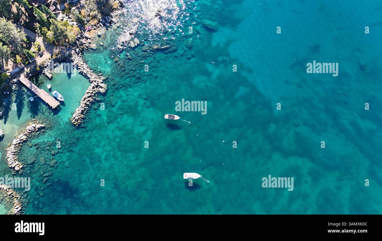 Aerial view of serene Lake Tahoe with crystal clear turquoise water ...
