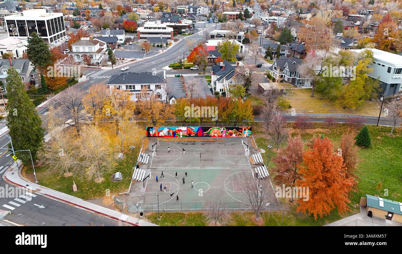Aerial view of colorful mural and vibrant basketball court in autumn ...
