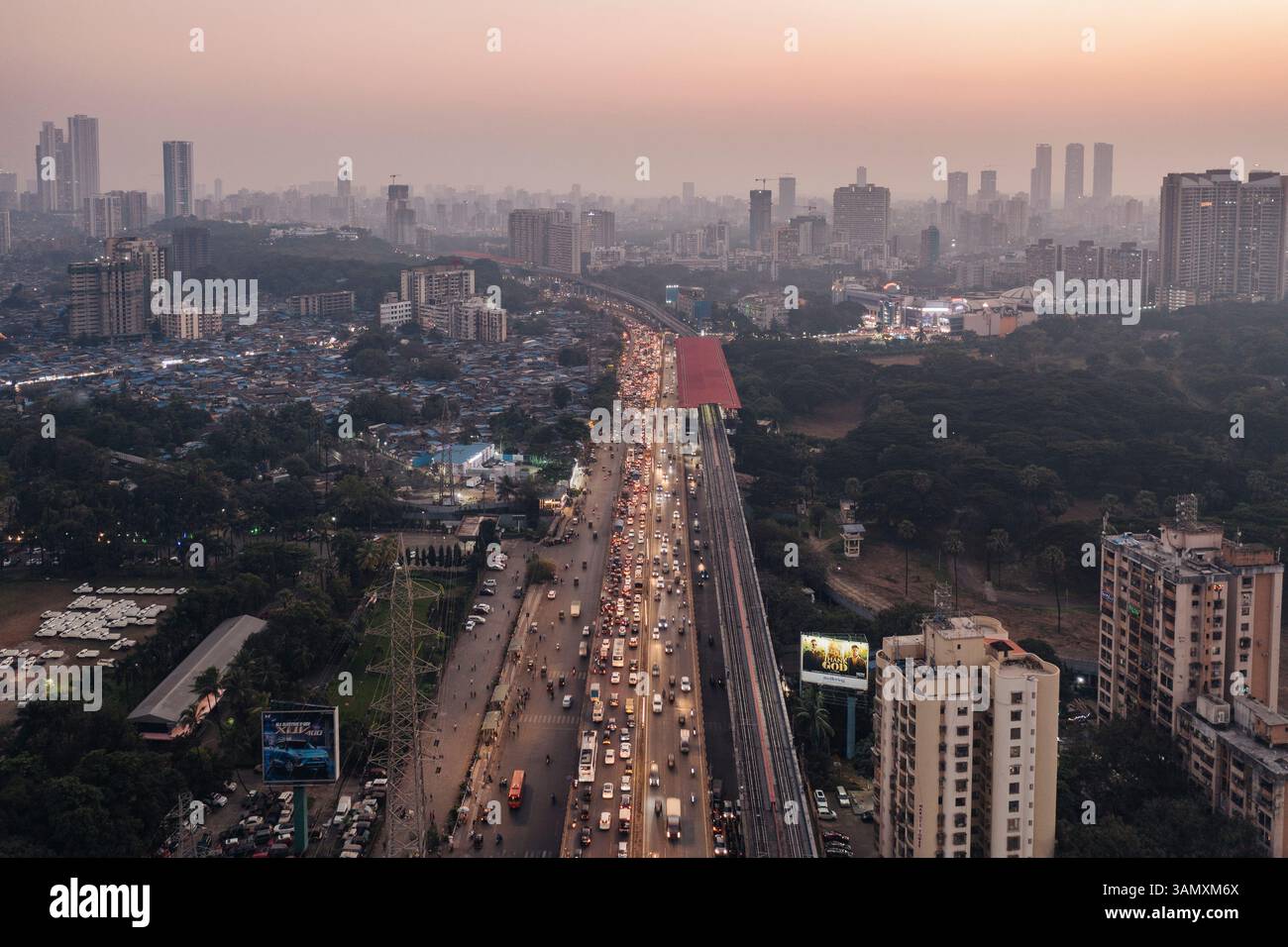 Aerial view of busy, crowded Mumbai city skyline at sunset with dense ...