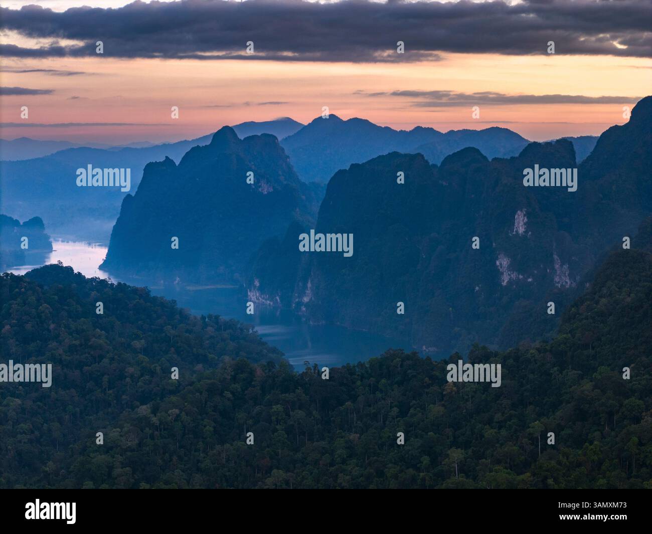 Aerial view of Cheow Larn Lake surrounded by lush rainforest and ...