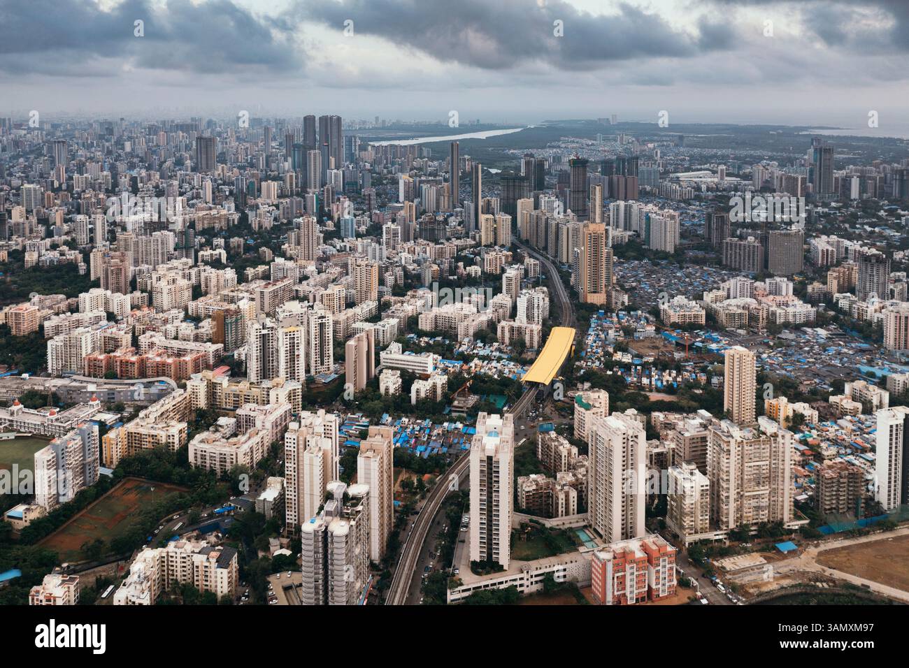 Aerial view of urban landscape with skyscrapers and busy roads, Mumbai ...