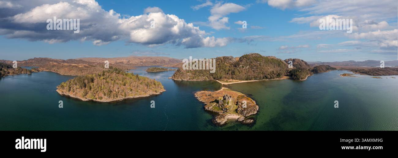 Aerial view of the picturesque Castle Tioram surrounded by tranquil ...