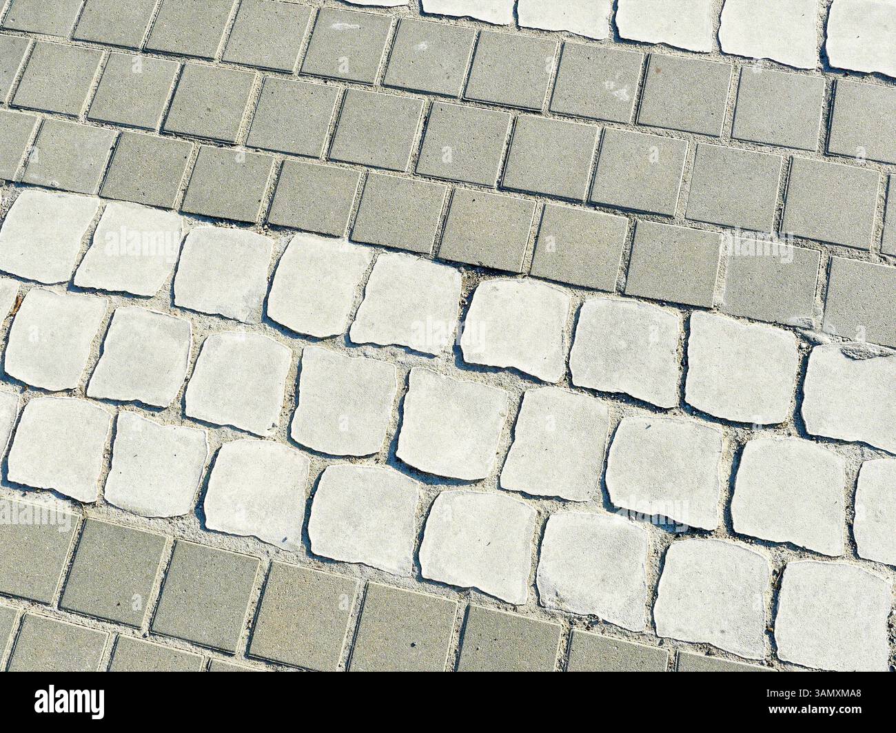 paved surface with white stones hinting at a zebra crossing. Structure ...