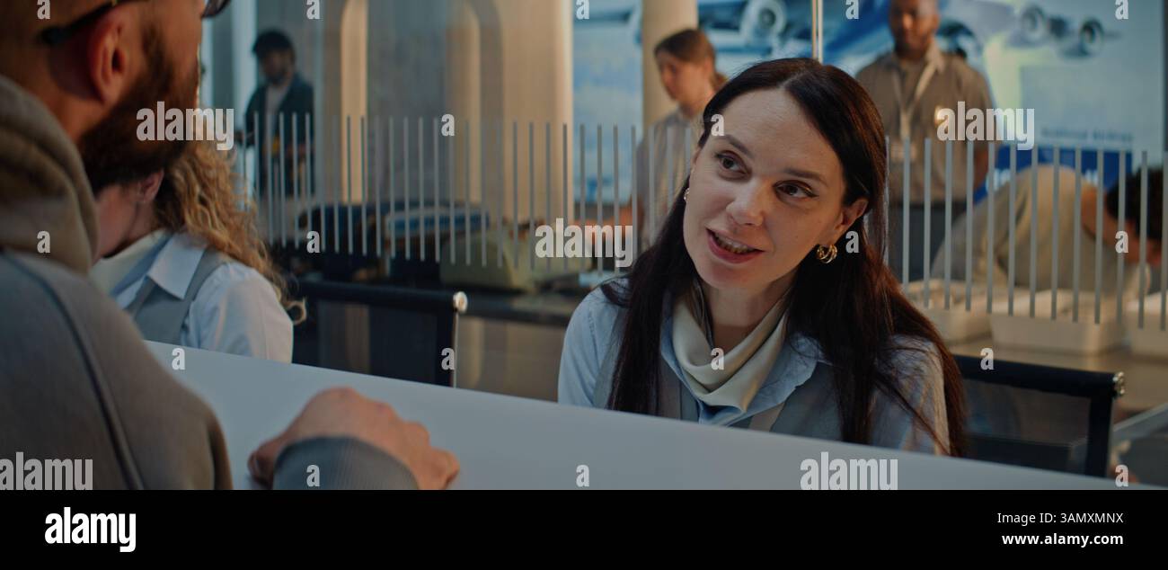 Airport Check-in Counter: Close Up of Female Airline Agent Talking and ...