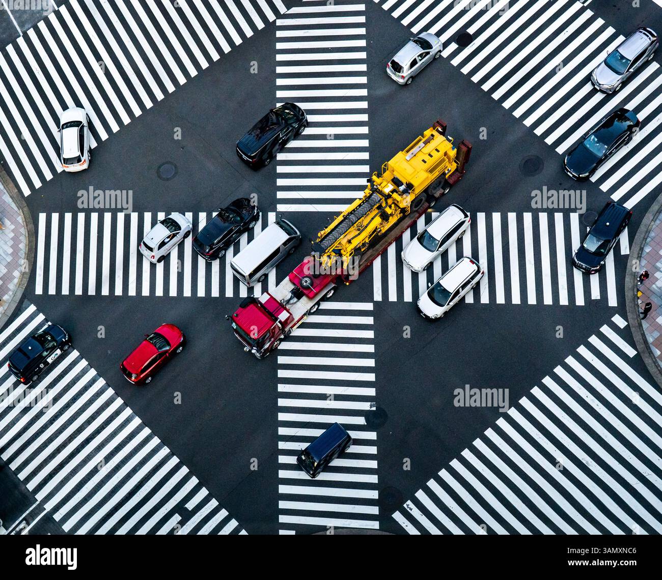 Aerial view of busy junction with heavy vehicular traffic and zebra ...