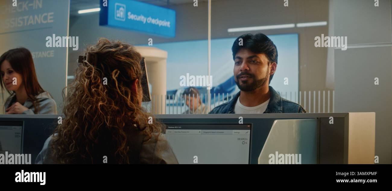 Airport Check-in Counter: Indian Man Verifying Personal ID Data by ...