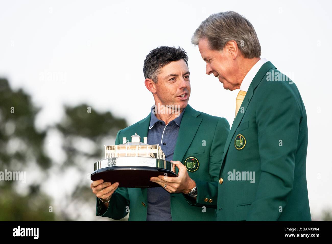 250413 Rory McIlroy of Northern Ireland pose Fred Ridley, Chairman of ...