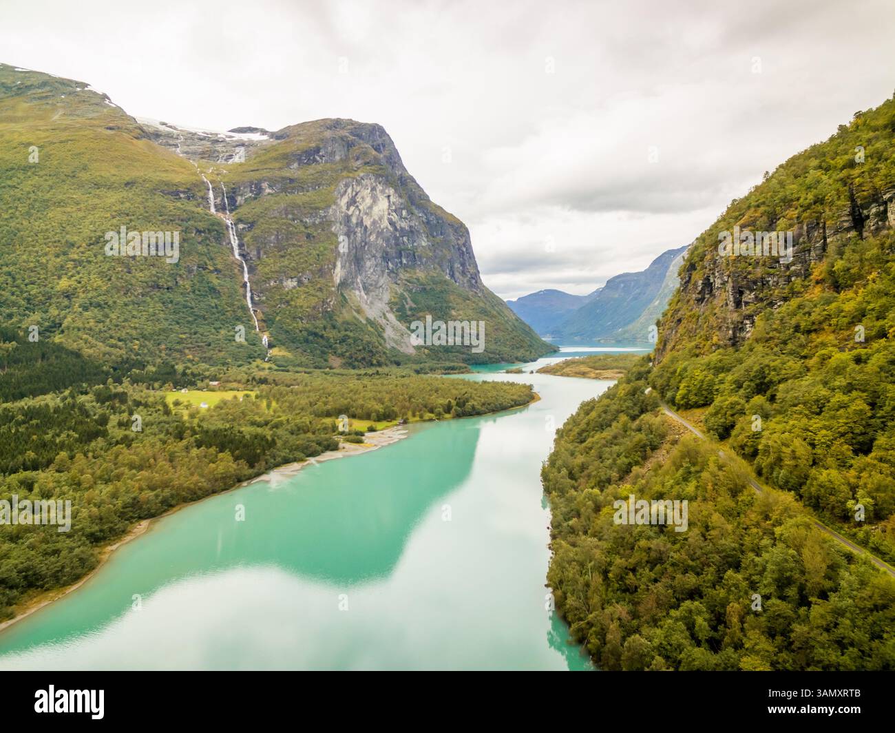 Aerial view of calm fjord crossing chain of tall mountains, Norway ...