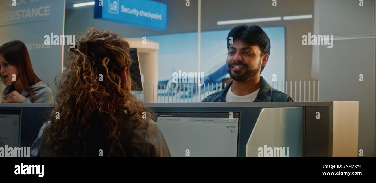 Airport Check-in Counter: Indian Man Verifying Personal ID Data by ...