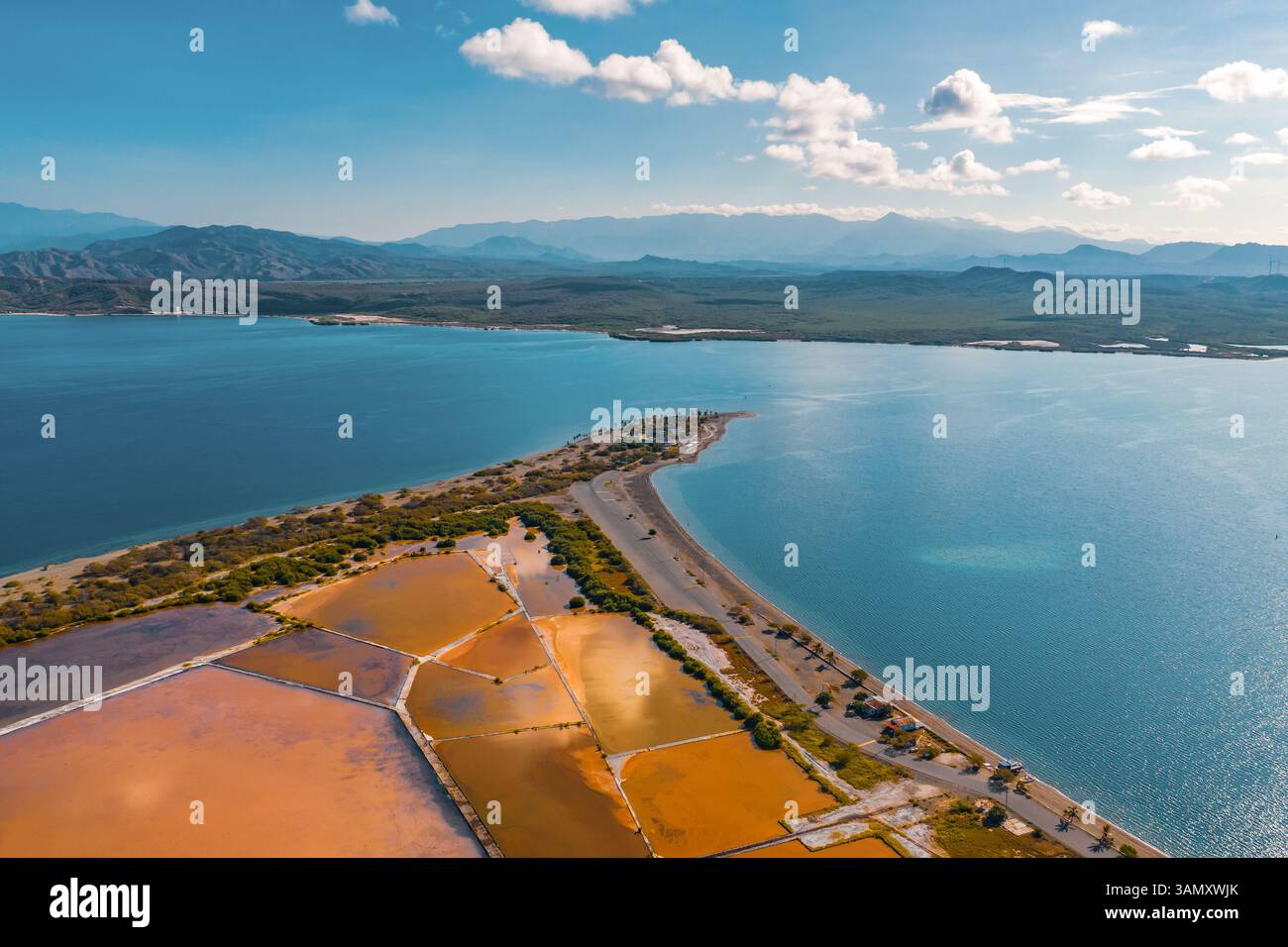 Aerial view of the colorful salt mines on Salinas beach with beautiful ...