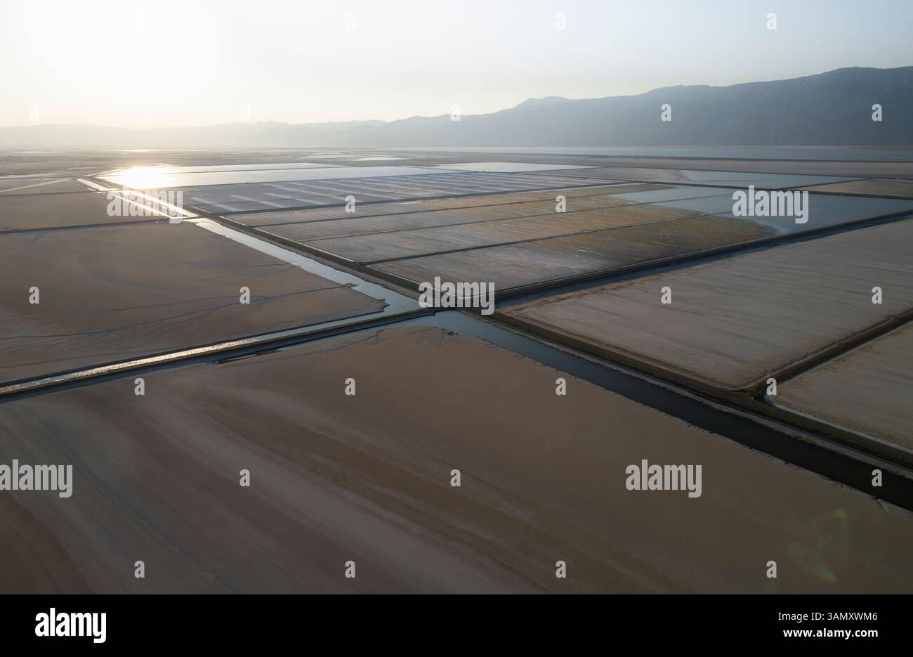 Aerial view of colorful salt farm with beautiful patterns and textures ...
