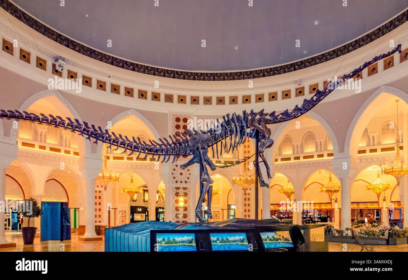Dubai Mall, UAE. Dinosaur skeleton display in a mall. Best for travel ...