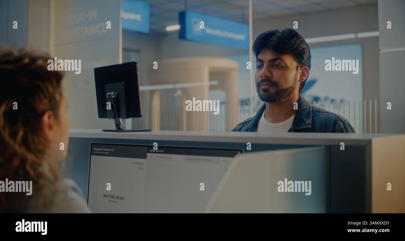Airport Check-in Counter: Indian Man Verifying Personal ID Data by ...